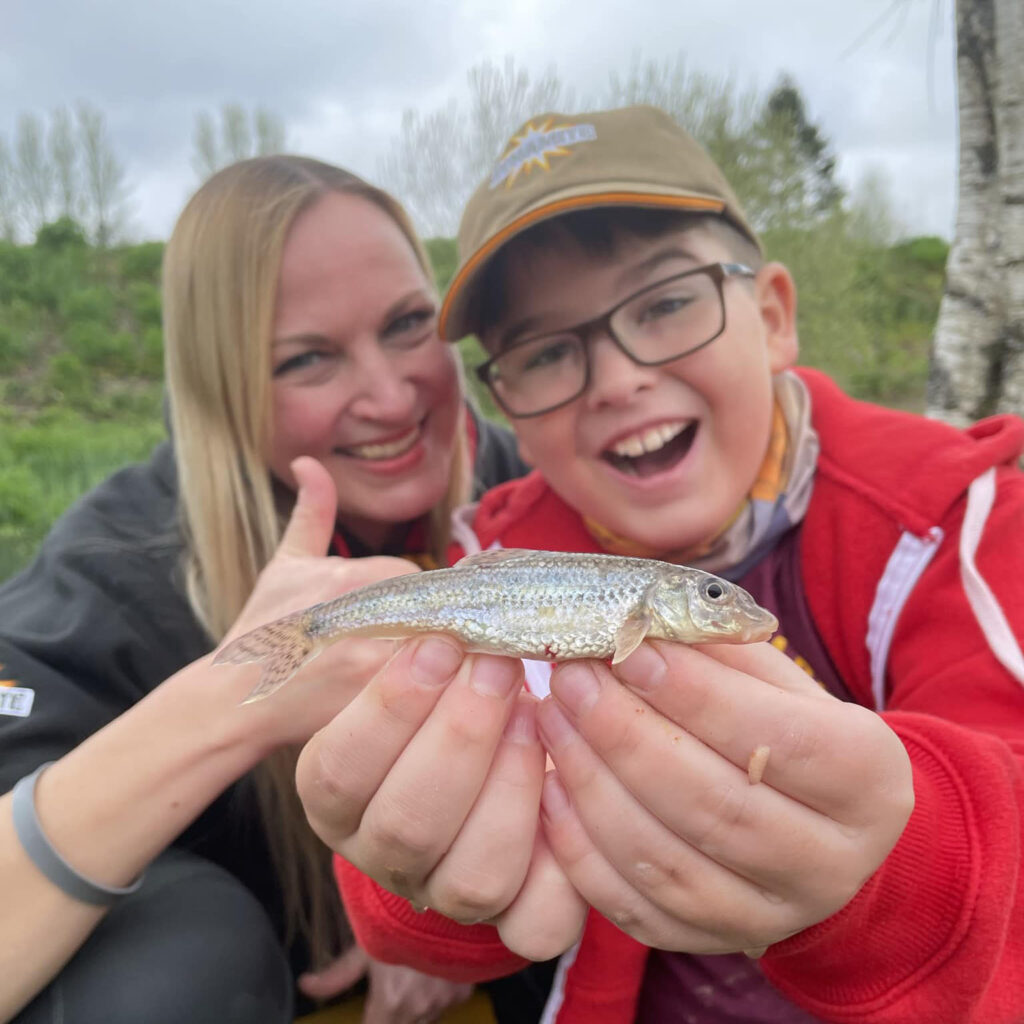 child with fish - Anglers Paradise